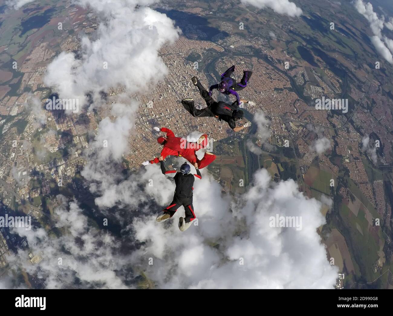Skydiving 4 way team making figures Stock Photo - Alamy