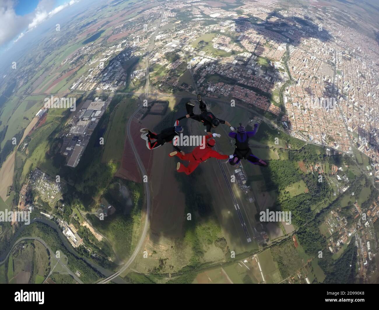 Skydiving 4 way team making figures Stock Photo - Alamy
