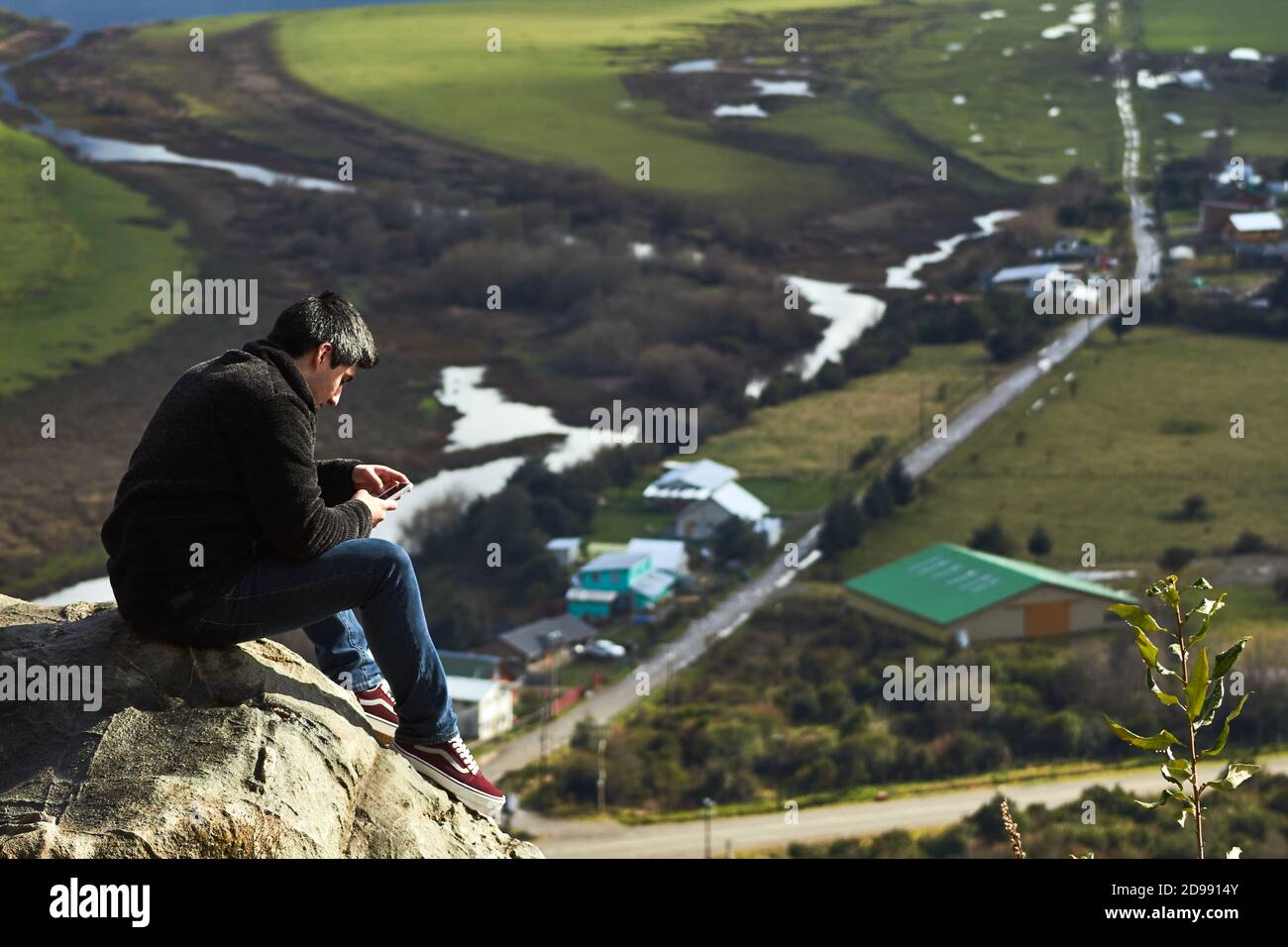 Shallow focus shot of a young male enjoying the beautiful view from ...