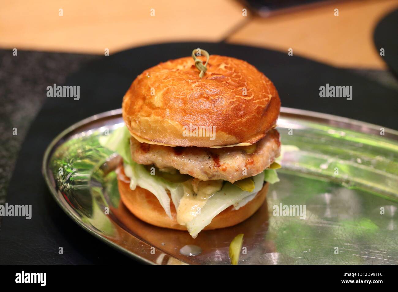 Grilled burger with meat patty, tomato and cheese Stock Photo - Alamy