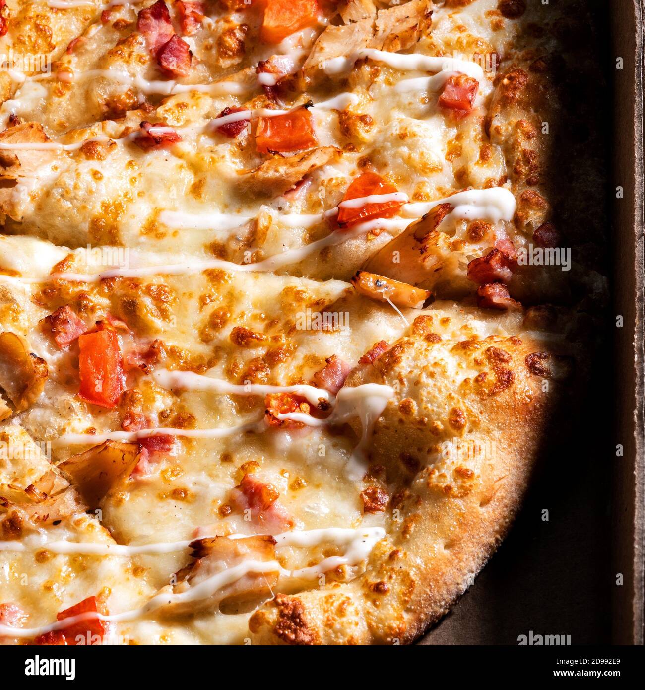 Slices of a pizza in the cardboard with shadows Stock Photo - Alamy