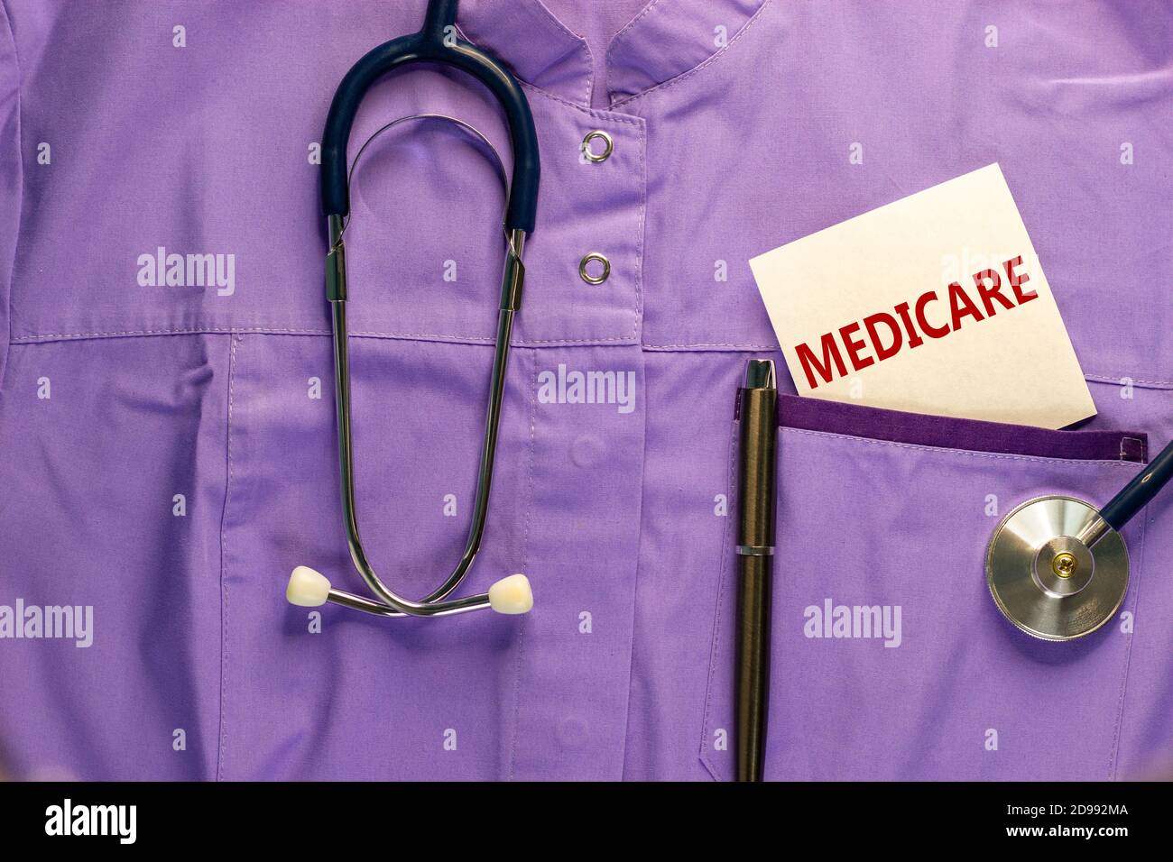 Medical uniform, white card with word medicare, metalic pen and ...
