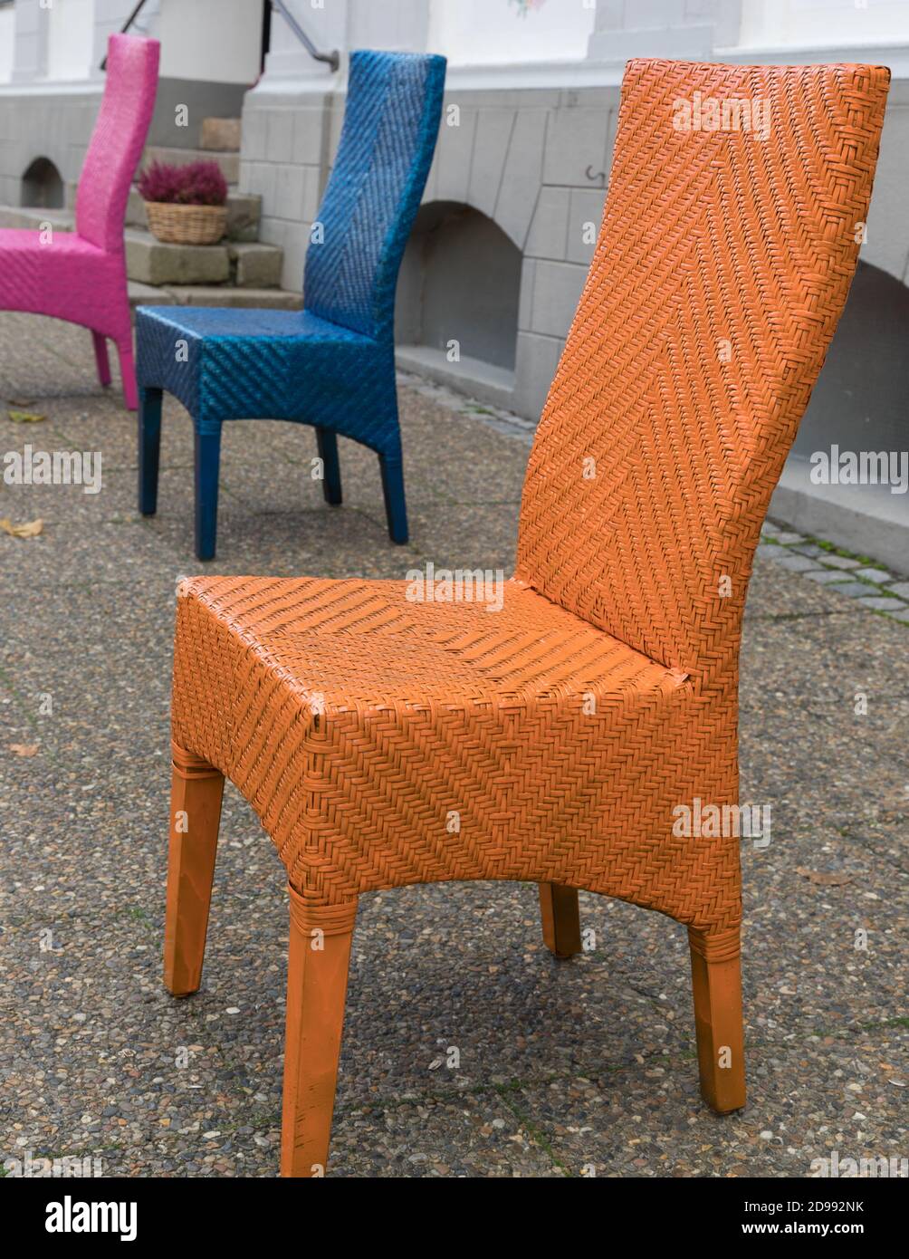 colored chairs with a large back outdoors in a pedestrian area Stock ...