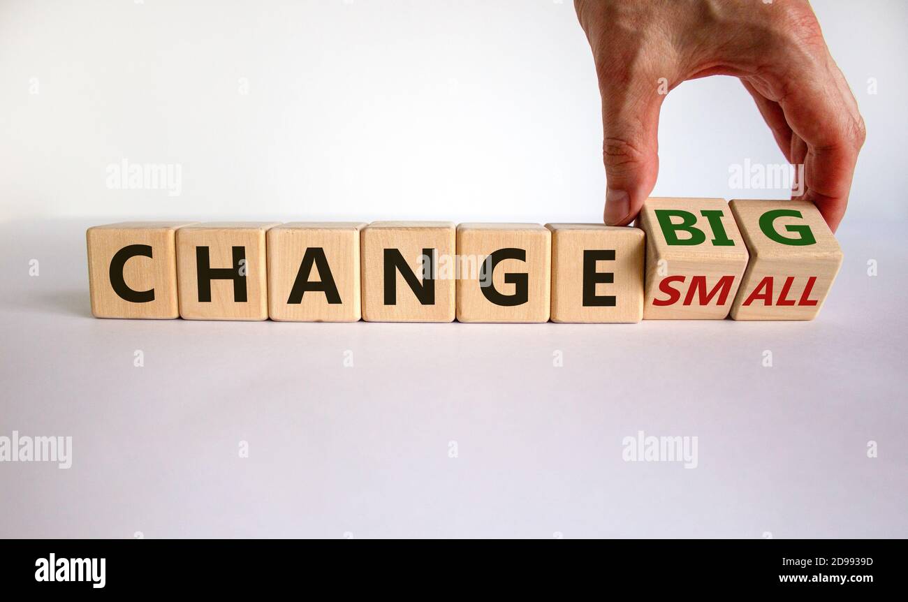 Male hand turns cubes and changes the expression 'change small' to ...