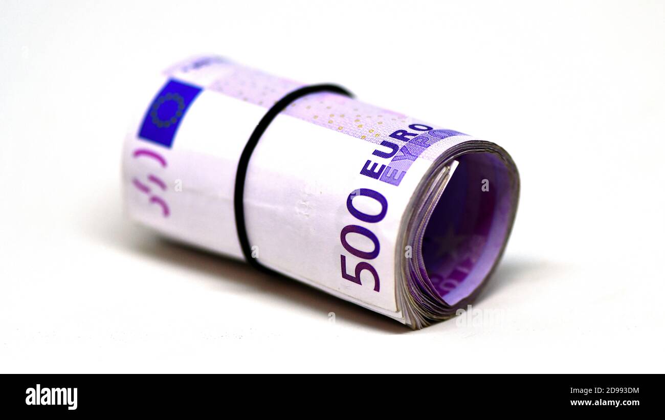 Roll of 500 euro money banknotes in rubber band Stock Photo - Alamy