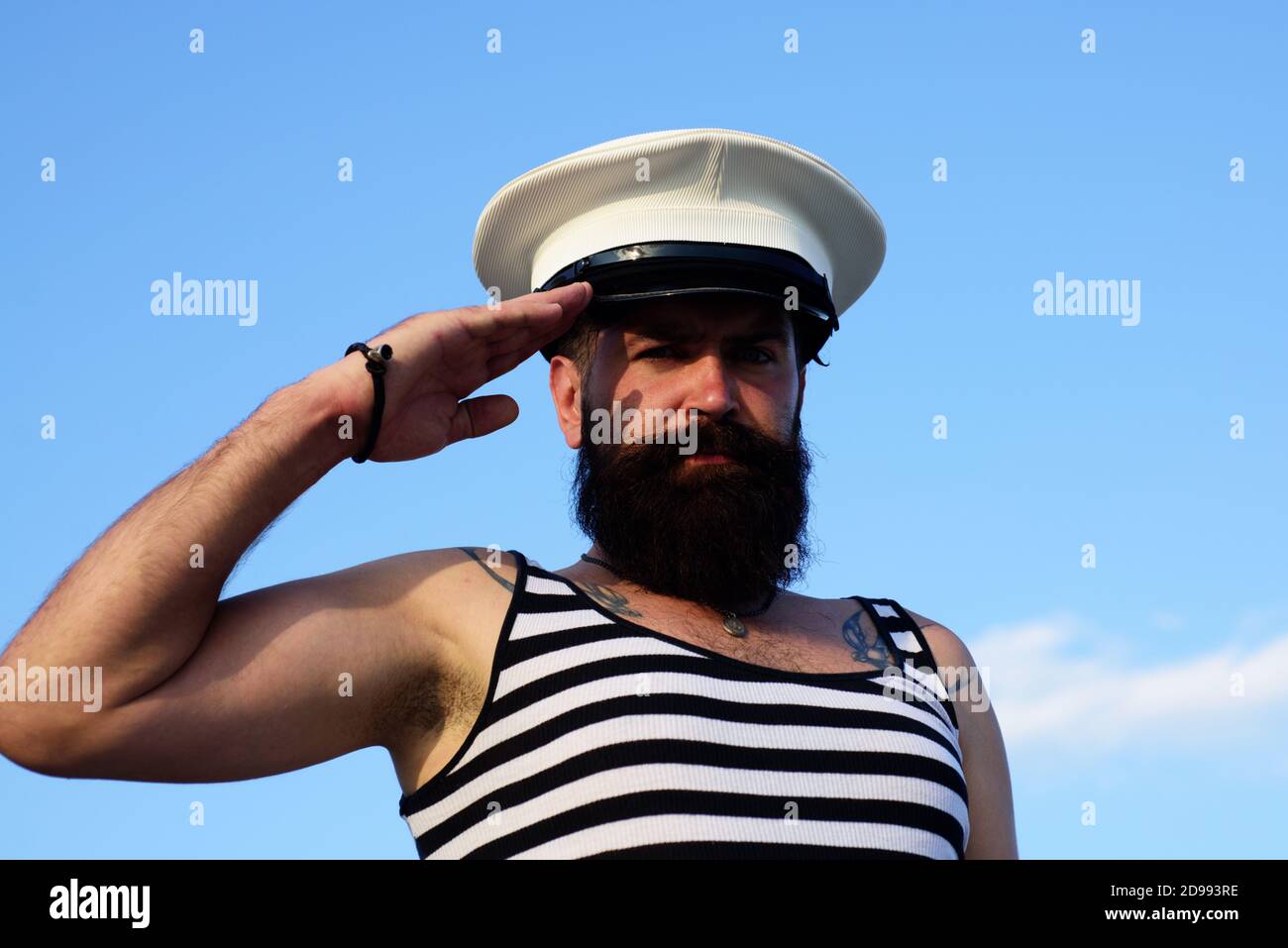 Funny captain sailor wearing hat. Seaman fun Stock Photo - Alamy
