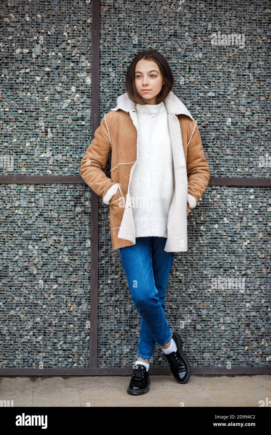 Young teenage girl in warm clothes spends time outdoors Stock Photo - Alamy