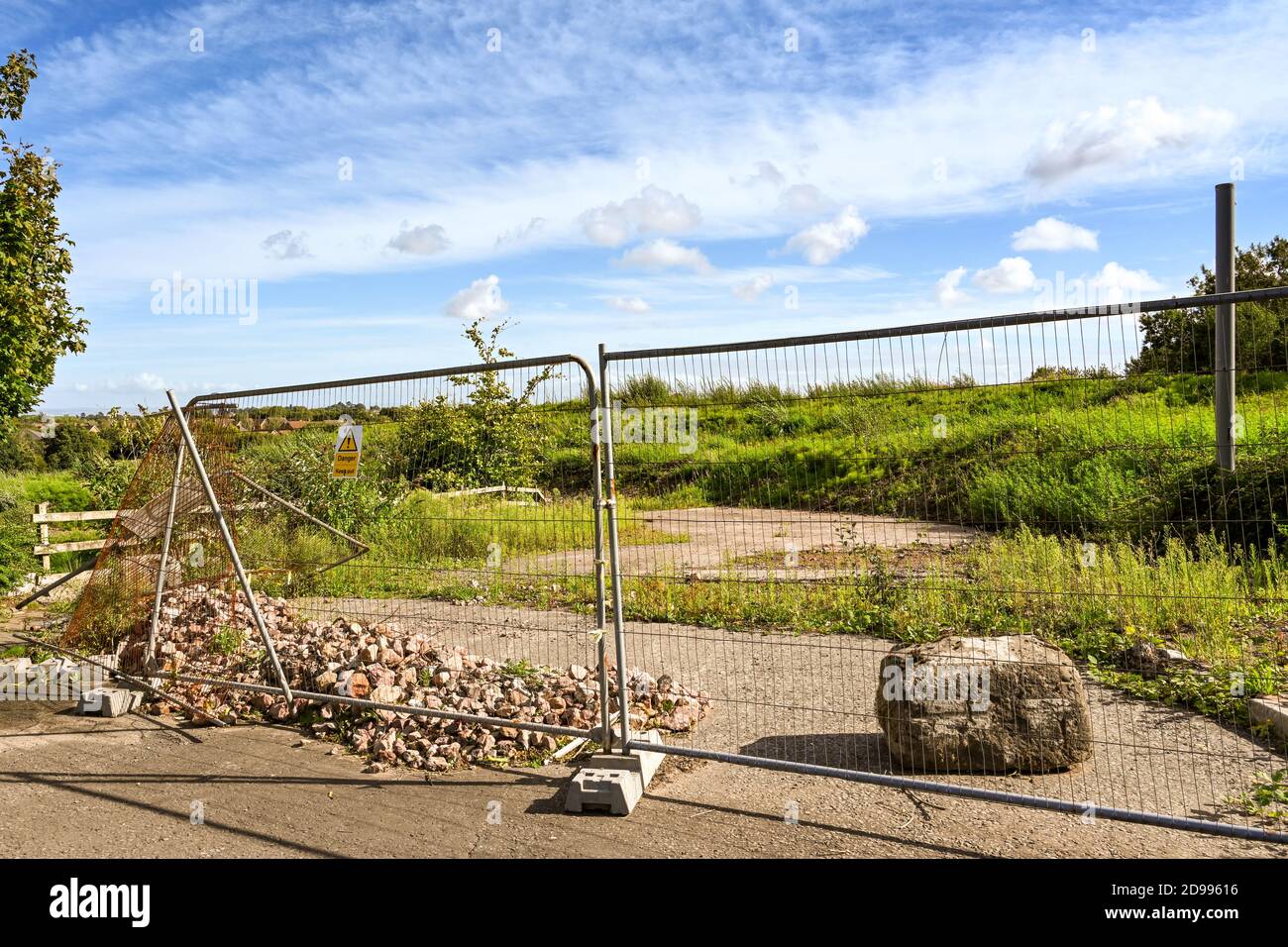 Metal fencing and rubble blocking access to a development site Stock ...