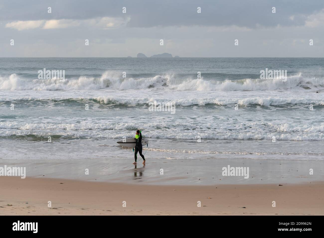 Surfers surfing in Baleal Island beach atlantic ocean waves in Peniche ...