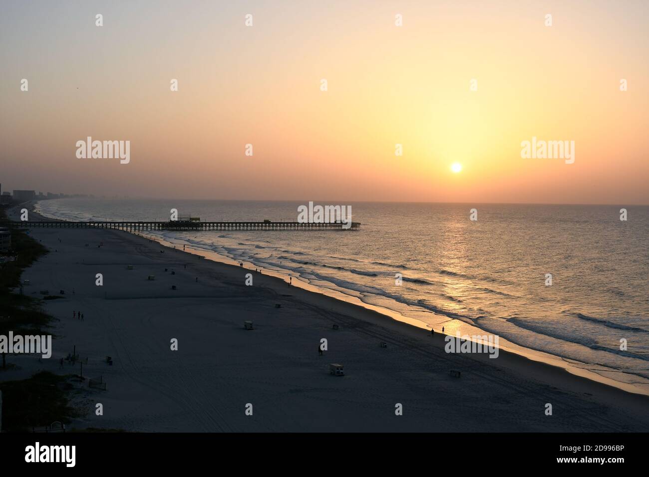 Sunrise on South Carolina Beach with pier Stock Photo - Alamy