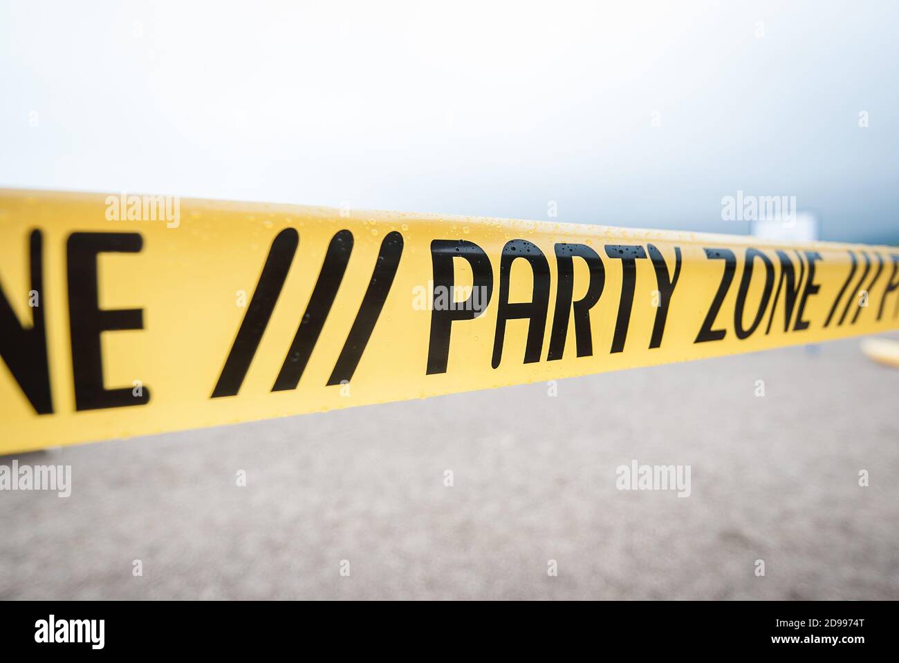Yellow barrier tape for no entry party zone Stock Photo - Alamy