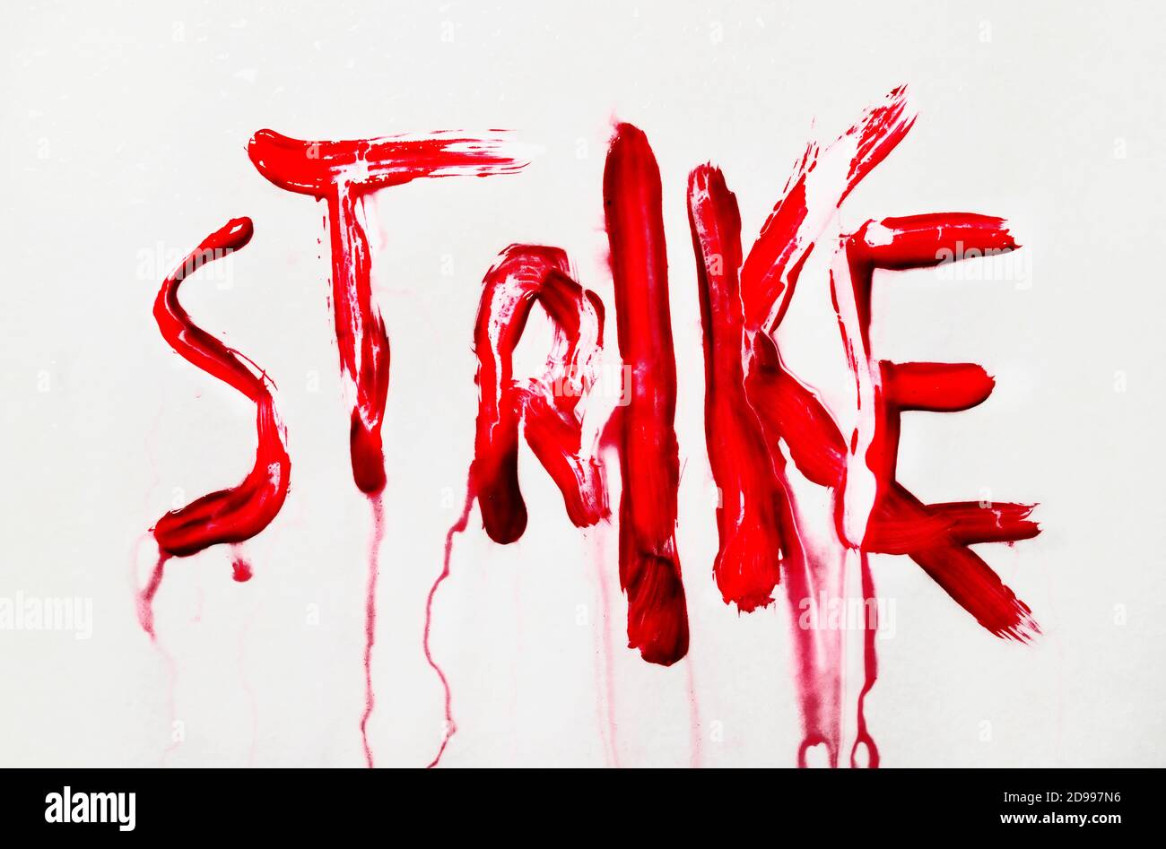 Red strike text on white background Stock Photo - Alamy