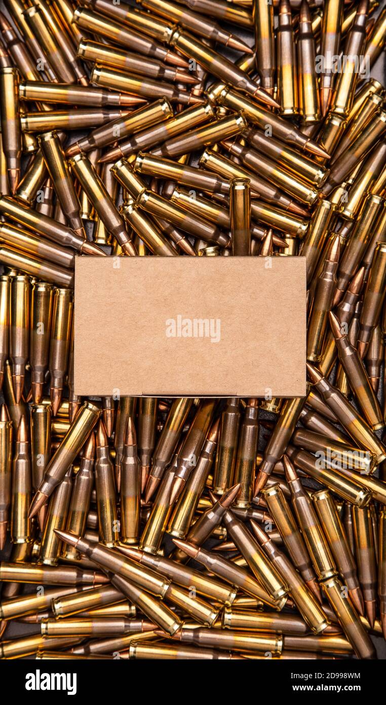 Background from cartridges for a carbine. A box of cartridges ...