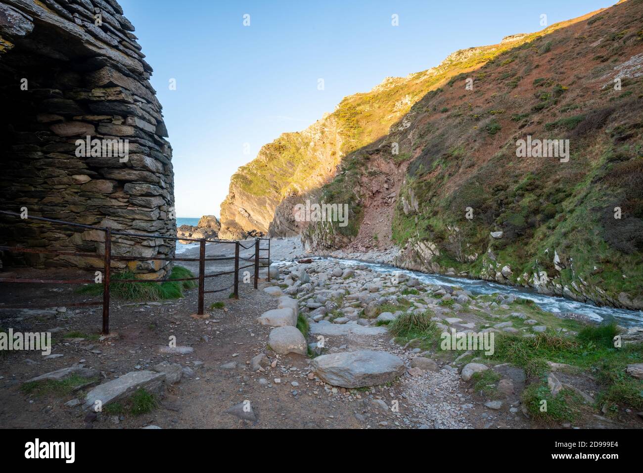 Long exposure of the river Heddon flowing onto the beach at Heddons ...