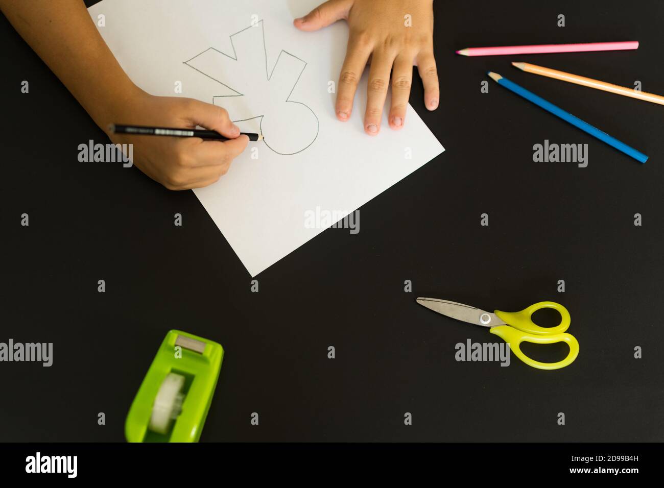 Top view of a child hand drawing a human sketch Stock Photo - Alamy