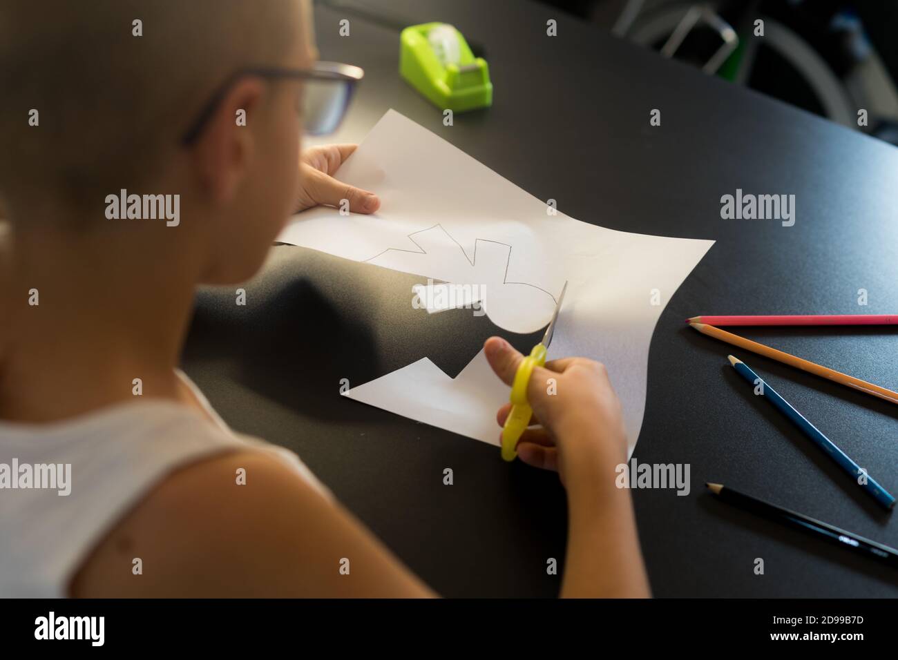 Boy cutting drawing scissors hi-res stock photography and images - Alamy