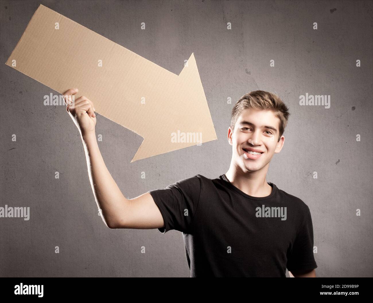 young man pointing to himself with an arrow cardboard Stock Photo - Alamy