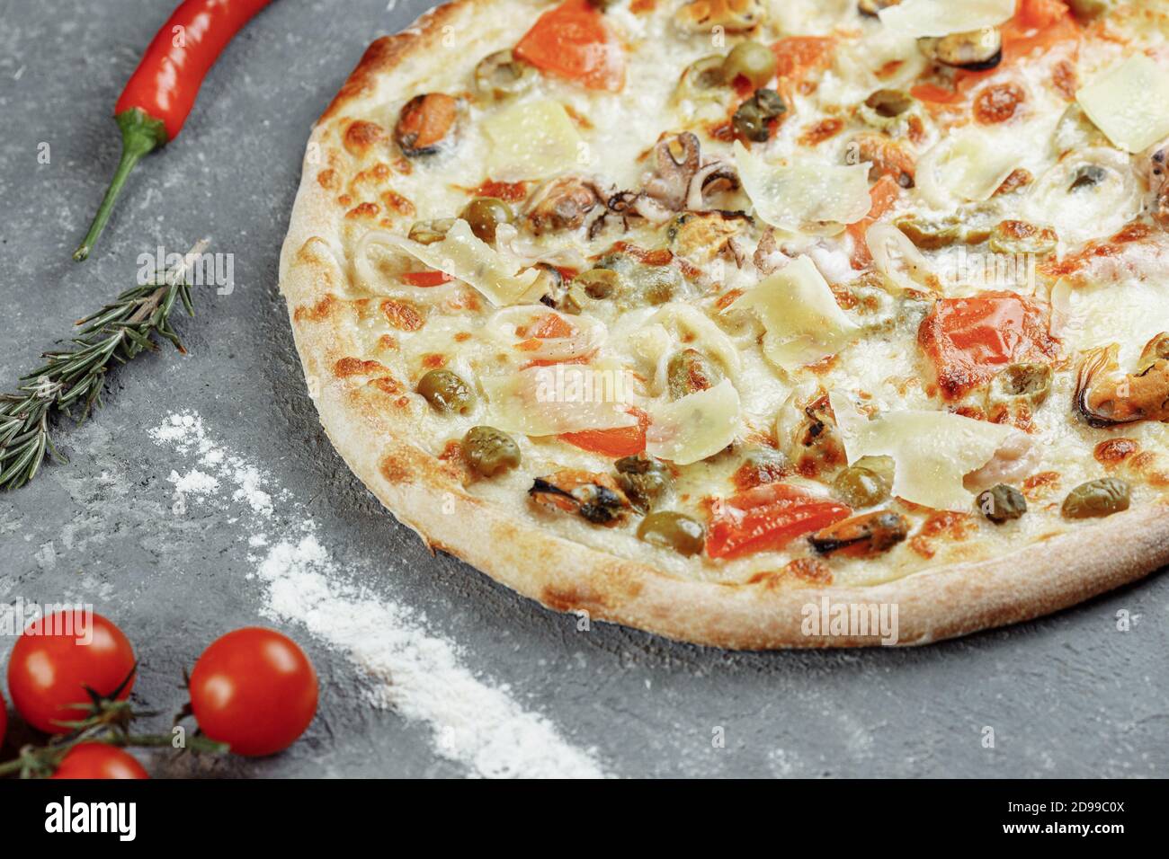 Seafood pizza. pizza with mozzarella, shrimp, octopus, squid, mussels ...