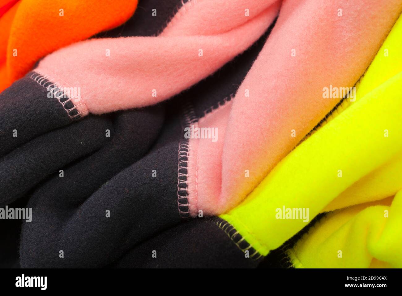 Colorful fleece jackets fragments with seams, close up photo Stock ...