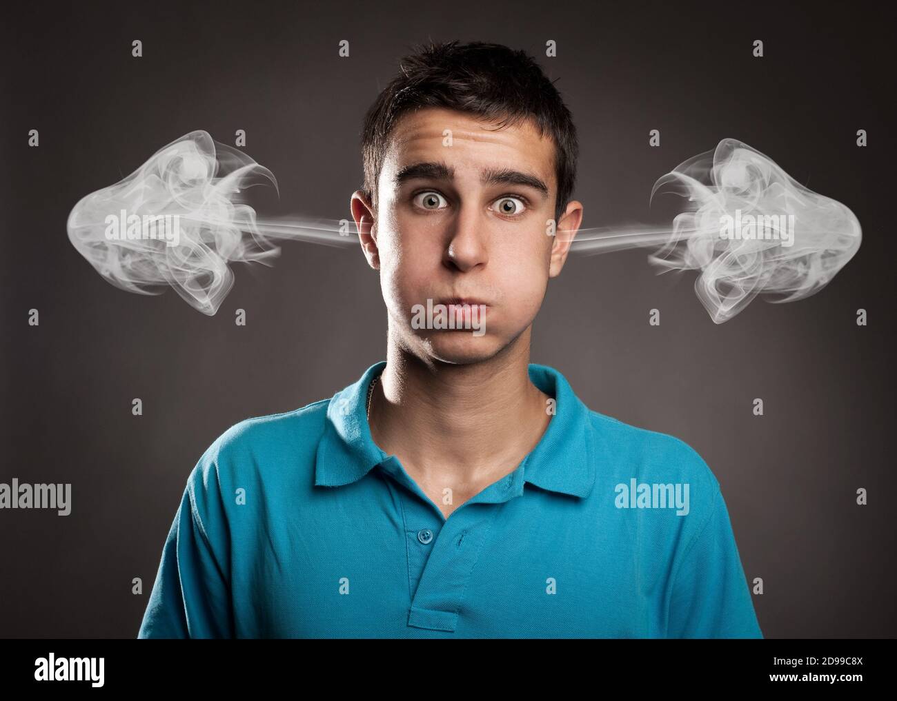young man with smoke on her ears Stock Photo - Alamy