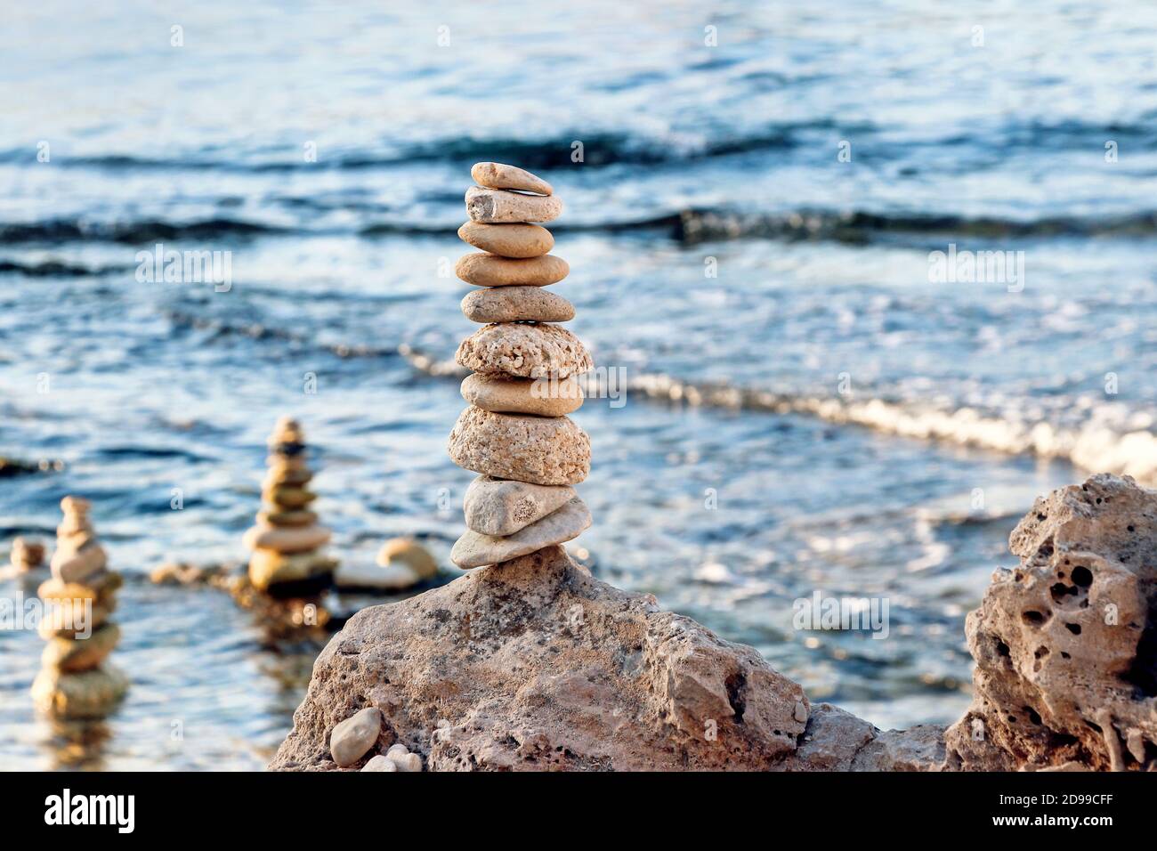stone heap at coast with blue sea in Malta Stock Photo - Alamy