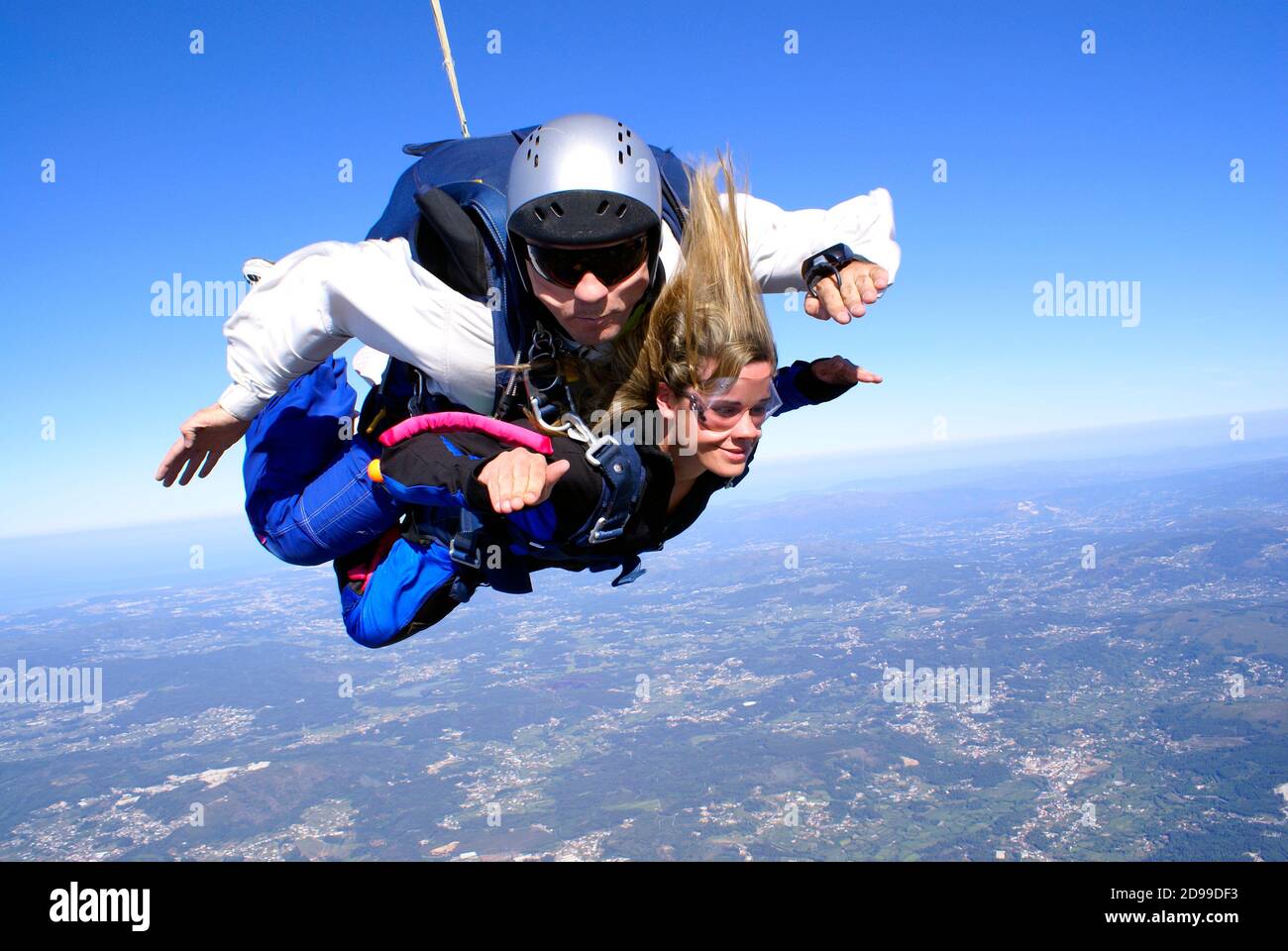 Sky diving tandem woman hair style Stock Photo - Alamy