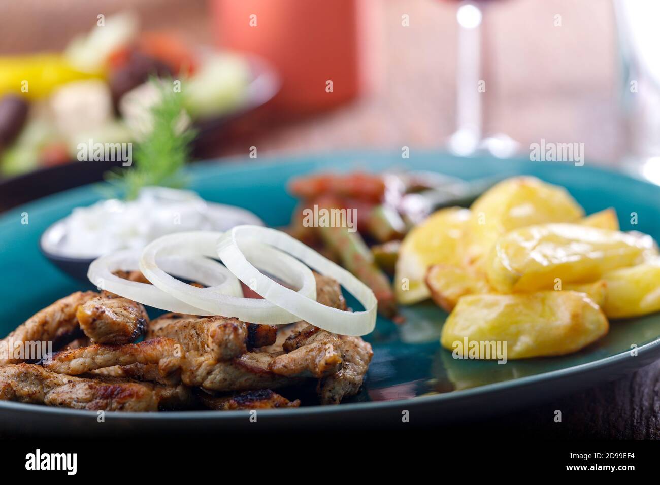 greek gyros with french fries on wood Stock Photo - Alamy