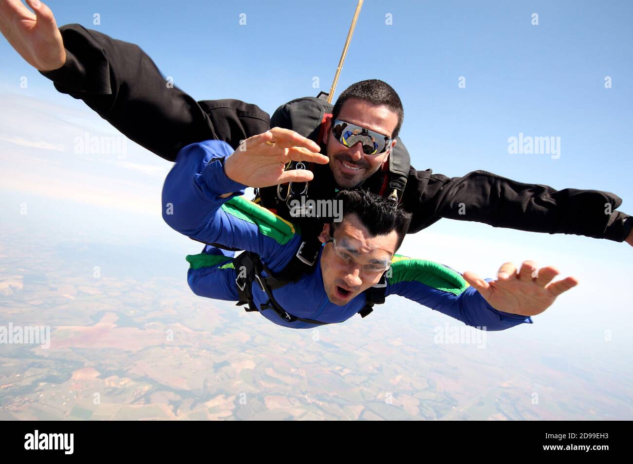 Skydive tandem friends Stock Photo - Alamy
