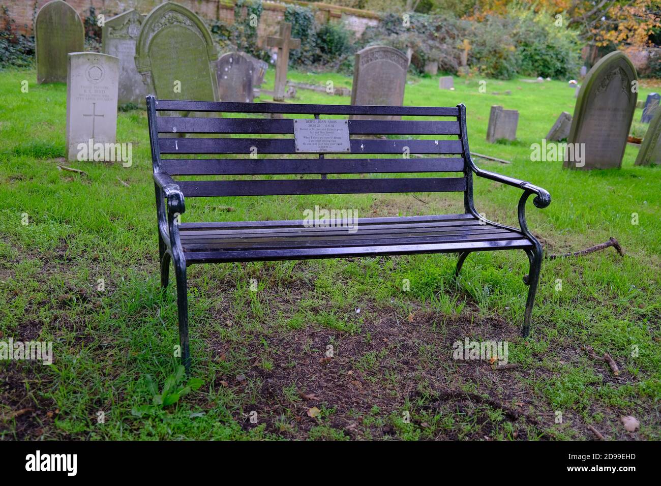 Wooden memorial bench in the graveyard of Little Plumstead church Stock ...