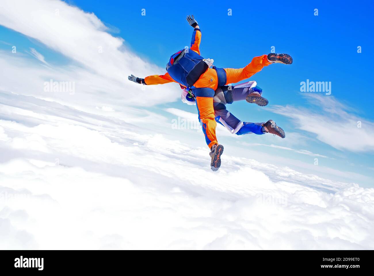 Skydiving tandem exit from the plane Stock Photo - Alamy
