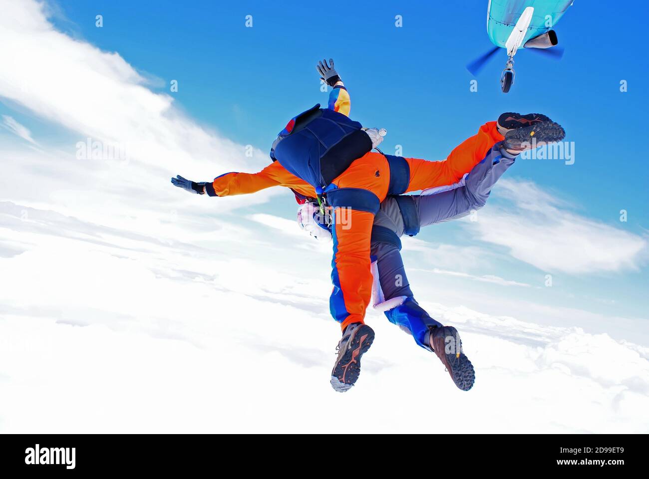 Skydiving tandem exit from the plane Stock Photo - Alamy