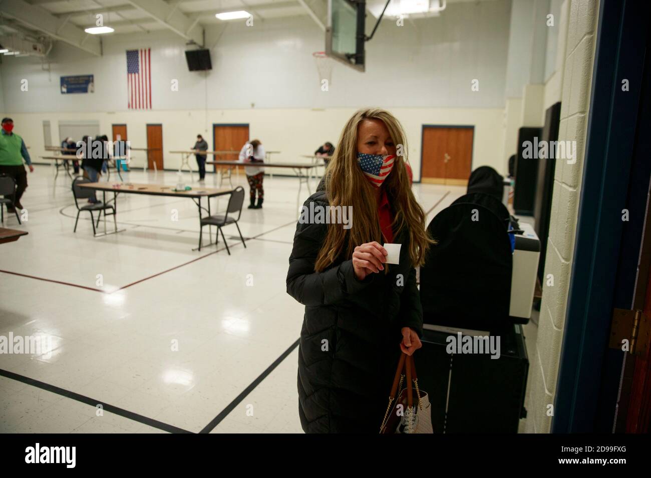A voter leaves with an “I Voted” sticker after voting in the 2020 ...