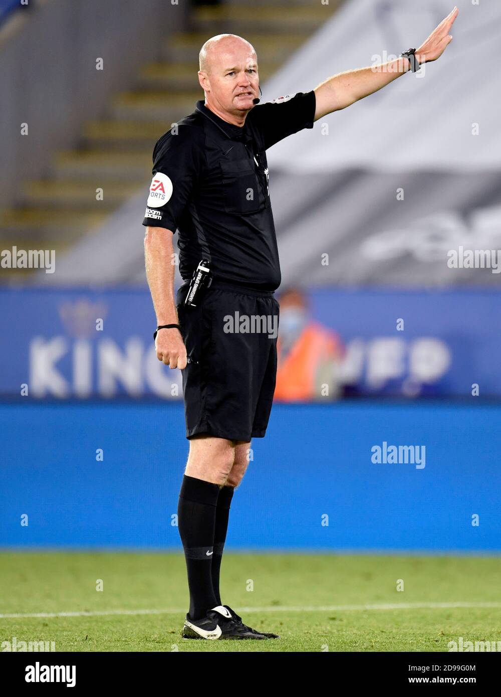 Referee Lee Mason gestures on the pitch during the Premier League match ...