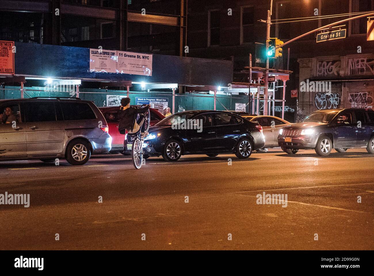 Bicycle against cars Stock Photo - Alamy