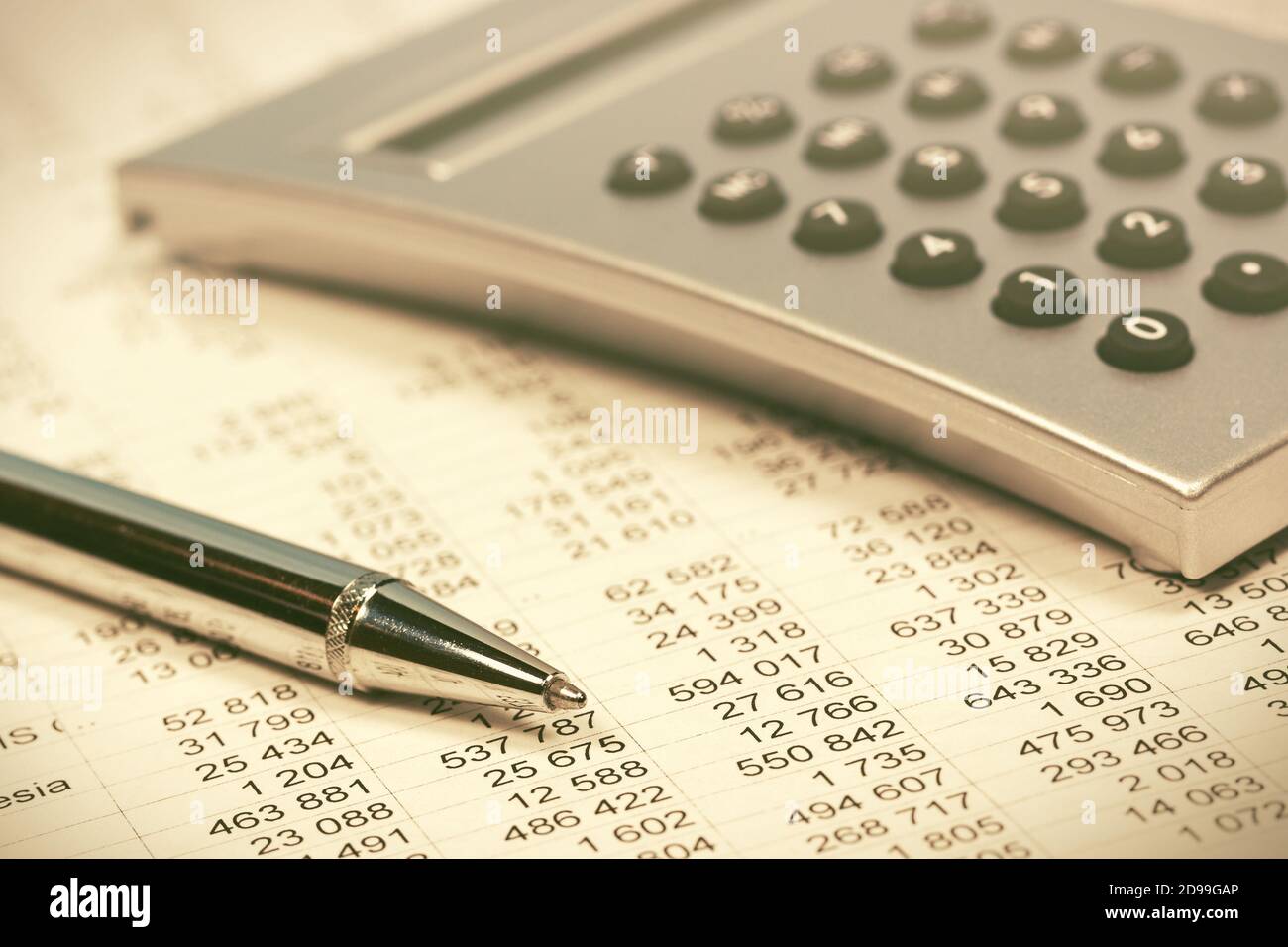 Financial accounting Pen and calculator on balance sheets Stock Photo ...