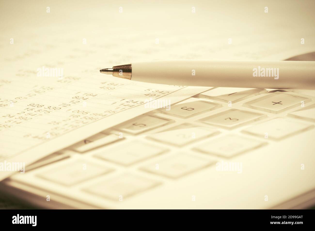 Financial accounting Pen and calculator on balance sheets Stock Photo ...