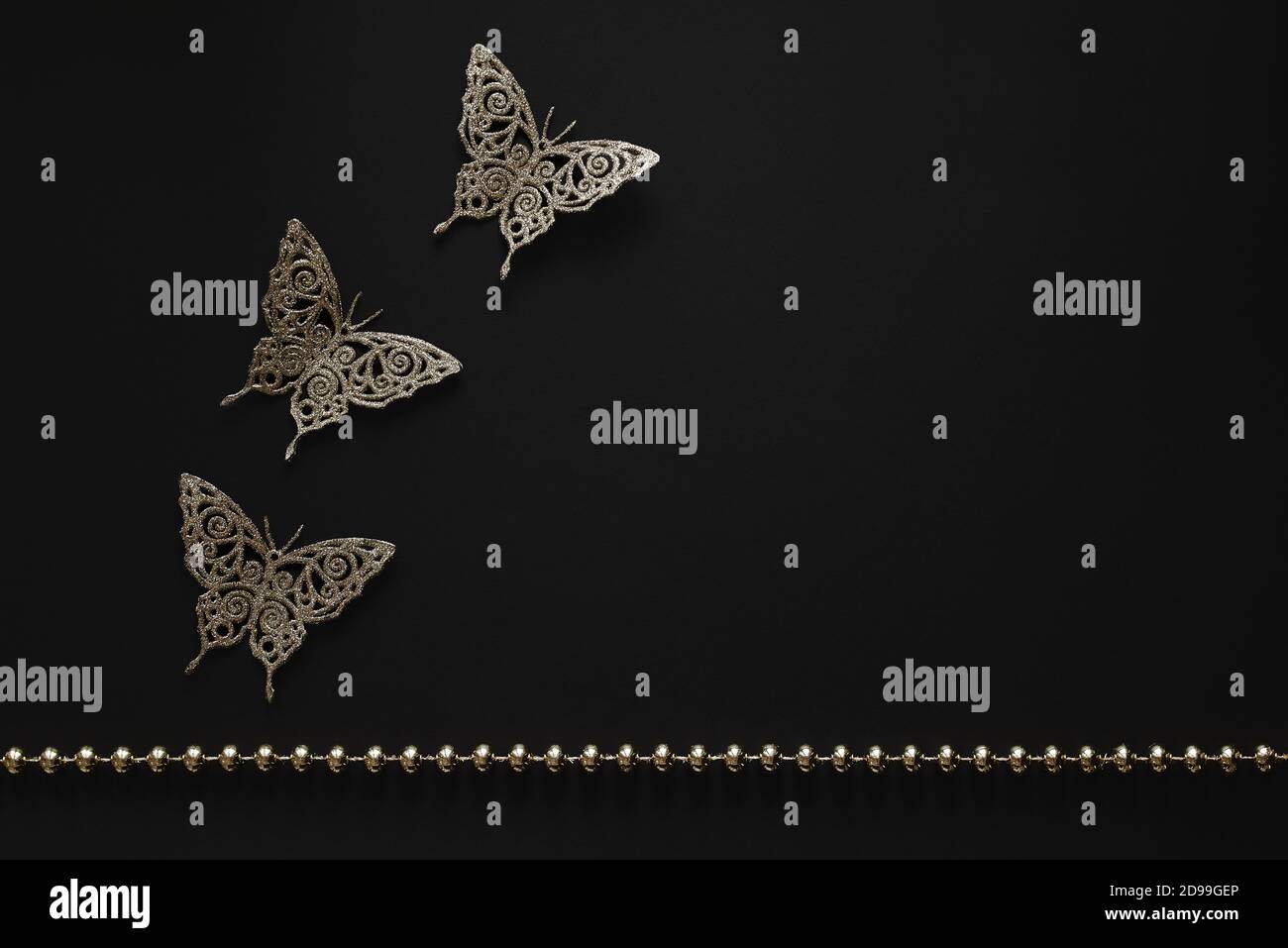Decorative butterflies on a black background Stock Photo - Alamy