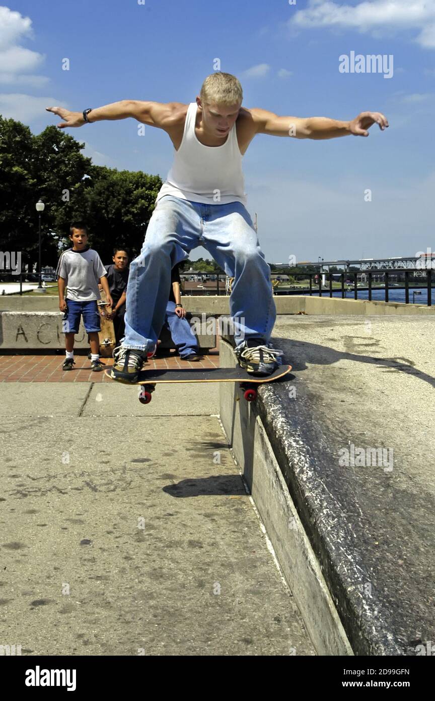 Skateboarder performing tricks on his skate board Stock Photo - Alamy