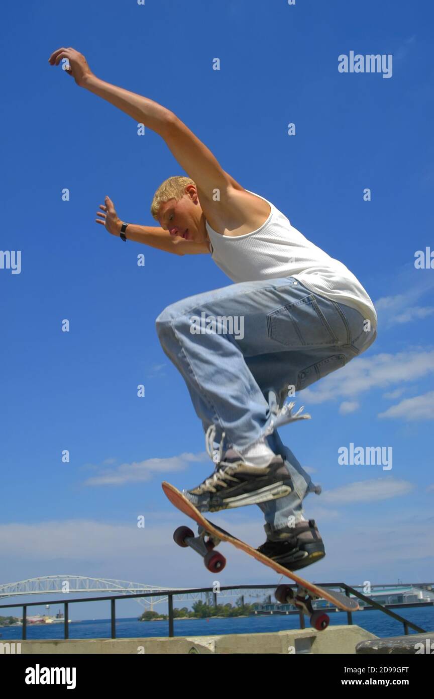 Skateboarder performing tricks on his skate board Stock Photo - Alamy