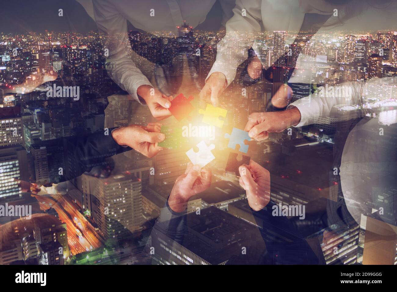 Teamwork of partners. Concept of integration and startup with puzzle ...