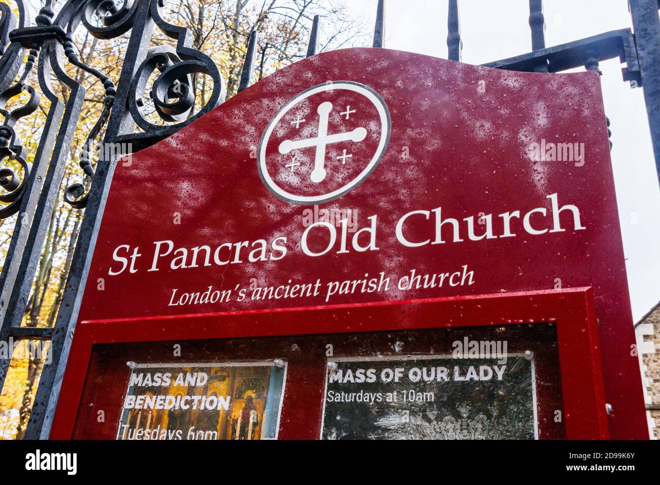 Sign on the gate of St Pancras Old Church, a Church of England parish ...