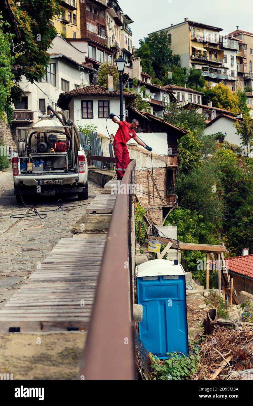 4 September, 2020, Veliko Tarnovo, Bulgaria. Man cleaning mobile ...
