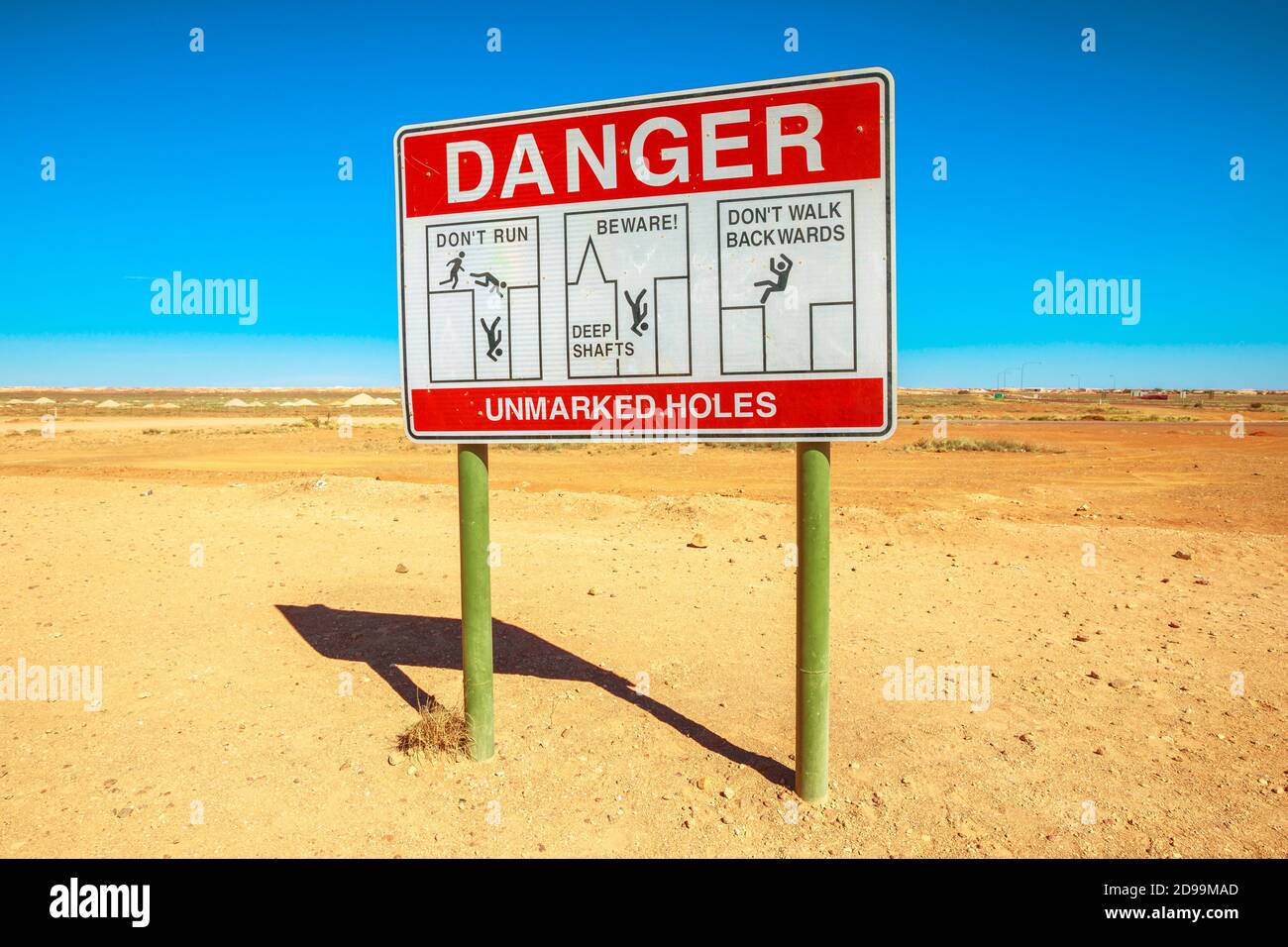 Danger road sign for unmarked holes in Coober Pedy underground town in ...
