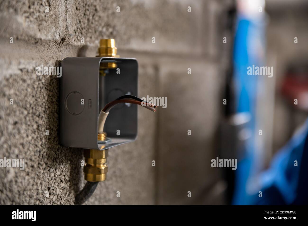 Isolated metal box socket outer case on garage wall ready to be wired ...