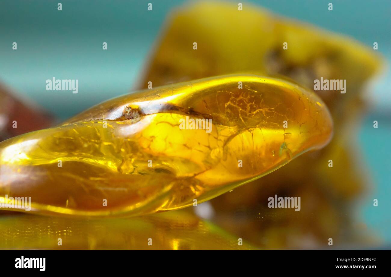 Natural close-up amber, yellow semi-precious stone, fossilized resin ...