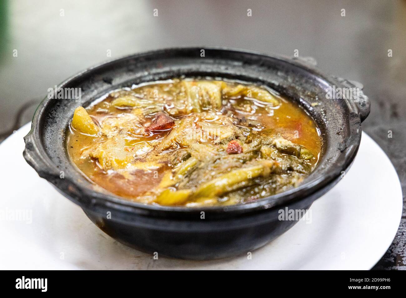 Traditional Chinese sour spicy mustard vegetable delicacy in claypot ...