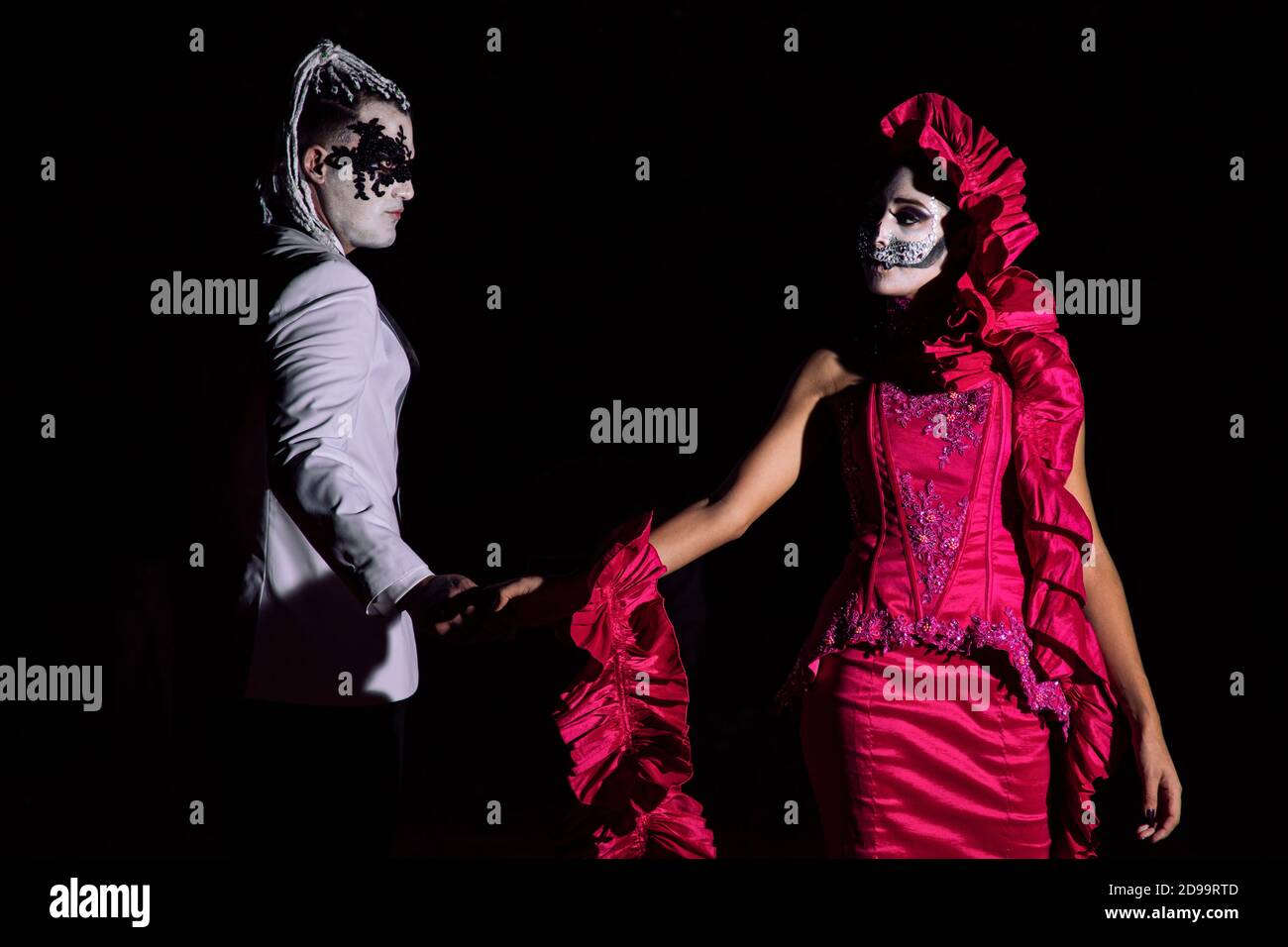 Catrina and catrin holding their hands on a dark night Stock Photo - Alamy