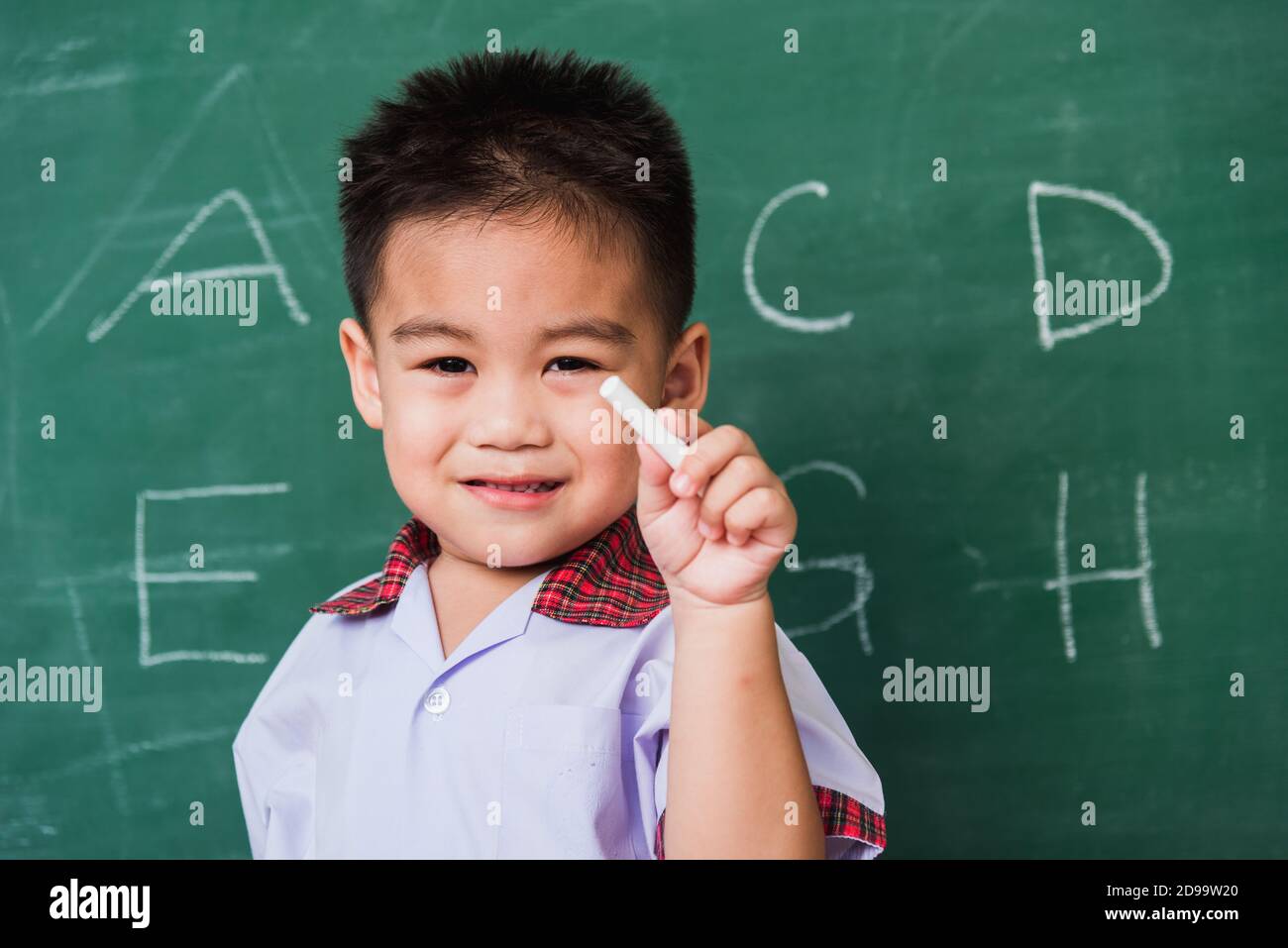 Back to School. Happy Asian funny cute little child boy kindergarten ...