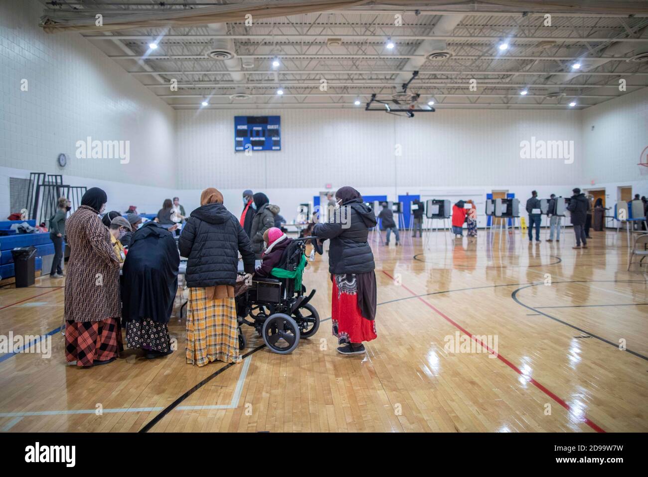 Minneapolis, Minnesota, USA. 3rd Nov, 2020. Voters wait in line at the polling station at the ...