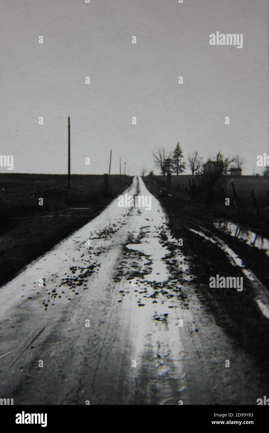 Fine 1970s vintage black and white photography of an empty country lane ...